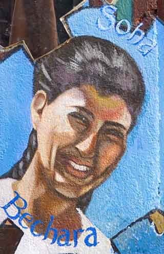 Soha Bechara in the mural La Lucha Continua in SF